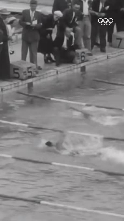 Dad hugs his son after becoming the Olympic swimming champion in 1952 ...